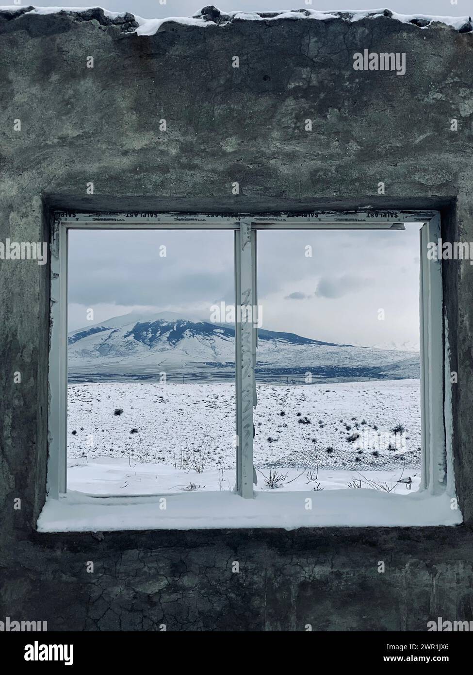Stone building window with view of mountainous field Stock Photo - Alamy
