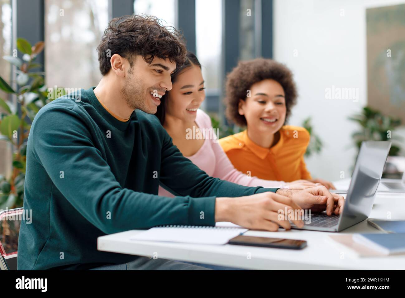 Happy diverse group of students collaborating on project Stock Photo ...