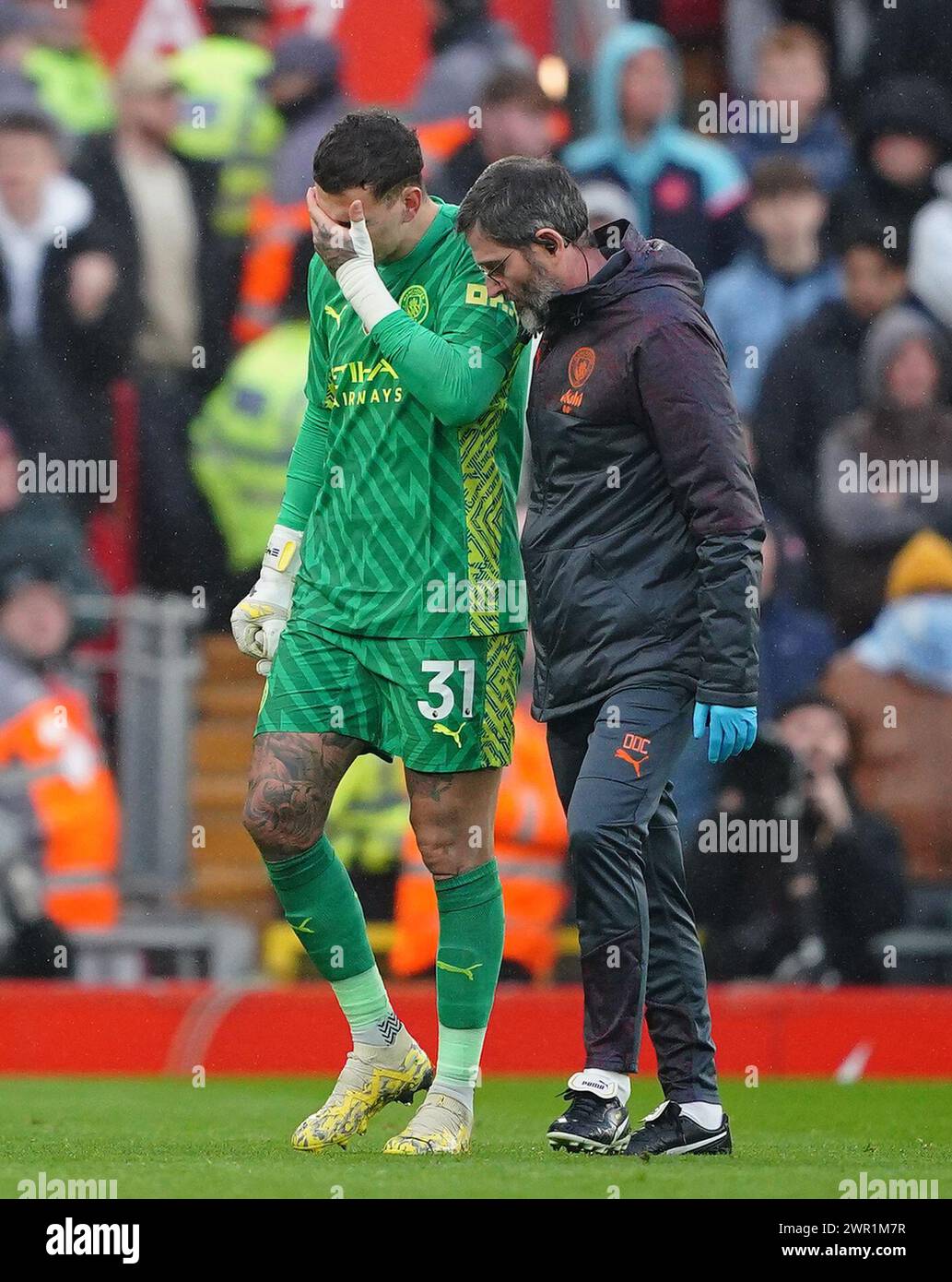 Manchester City goalkeeper Ederson leaves the game with an injury ...