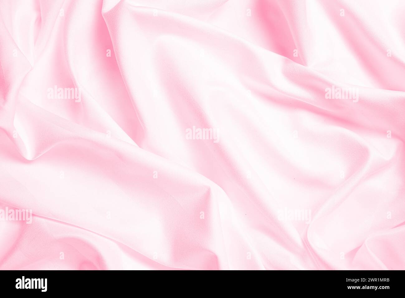 Waves and patterns of crumpled natural satin pink color fabric Stock ...