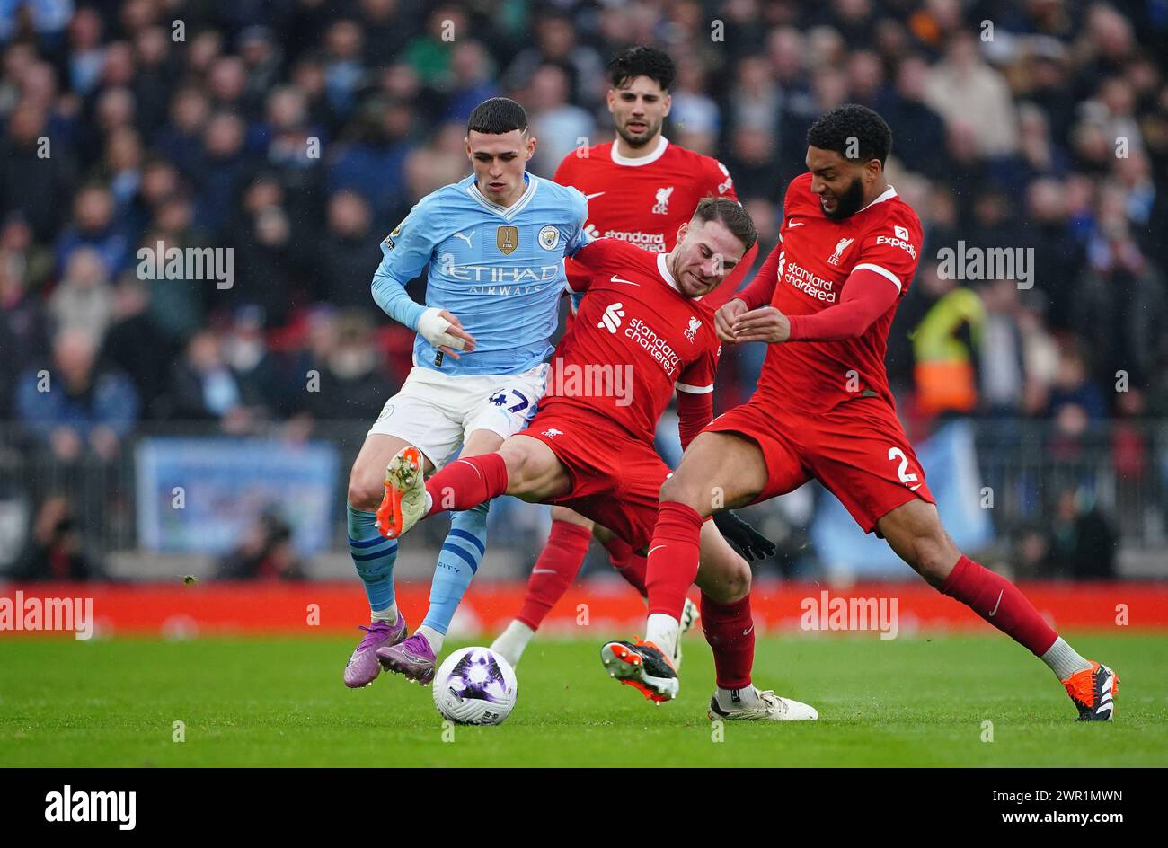 Manchester City's Phil Foden (left) and Liverpool's Alexis Mac Allister ...