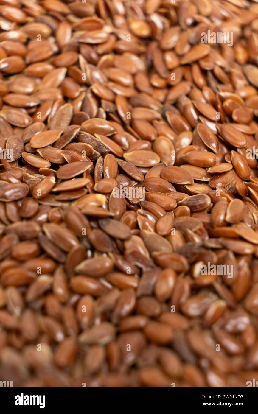 Macro set of flax seeds close-up vertical Stock Photo - Alamy