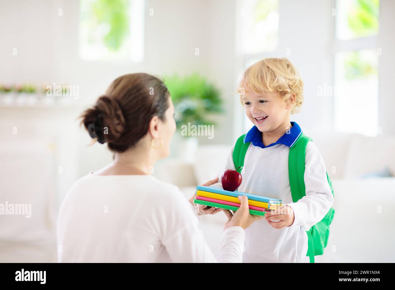 Child going back to school. Mother and kid getting ready for first ...