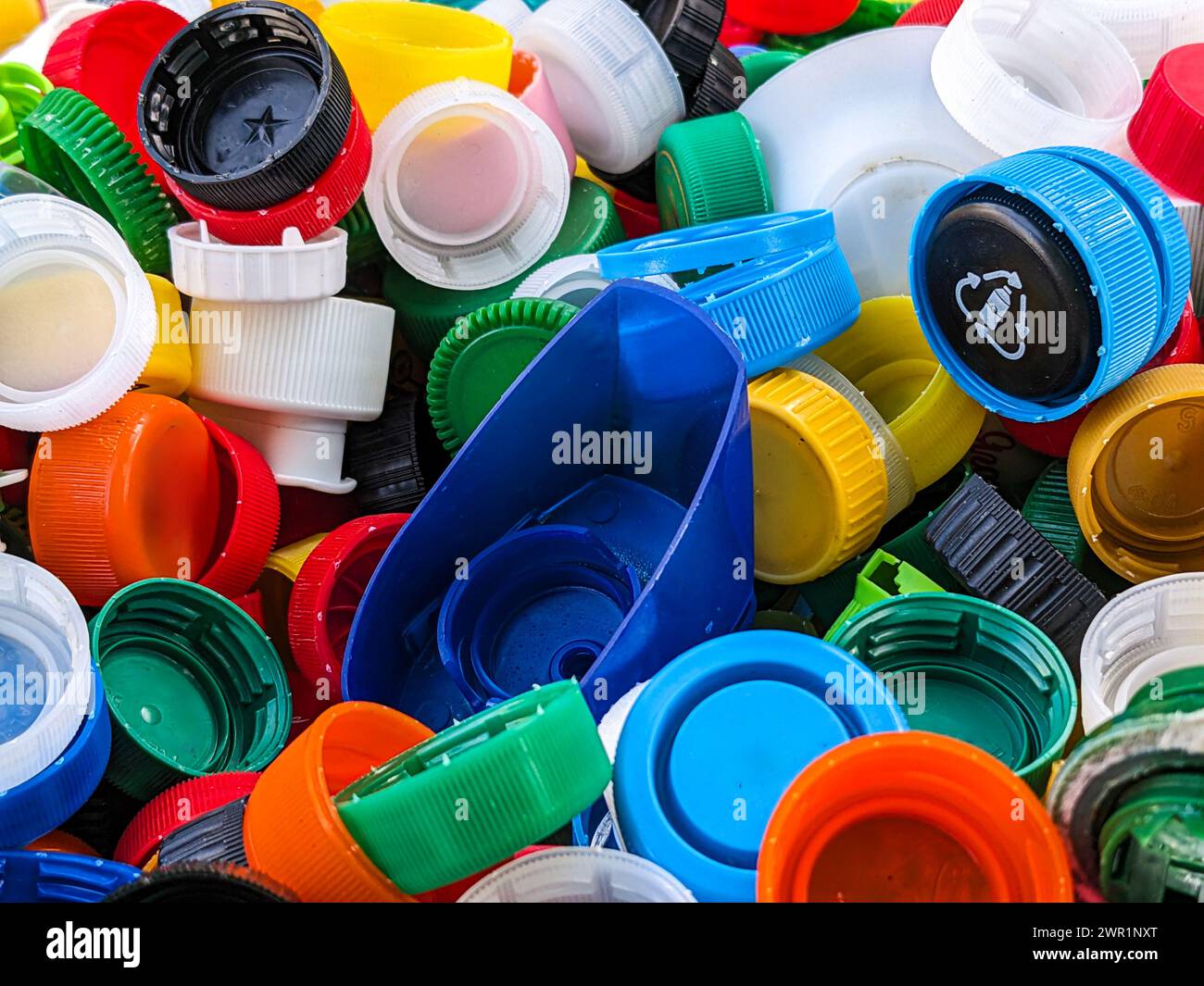 Lots of different plastic bottle caps. Garbage sorting Stock Photo - Alamy