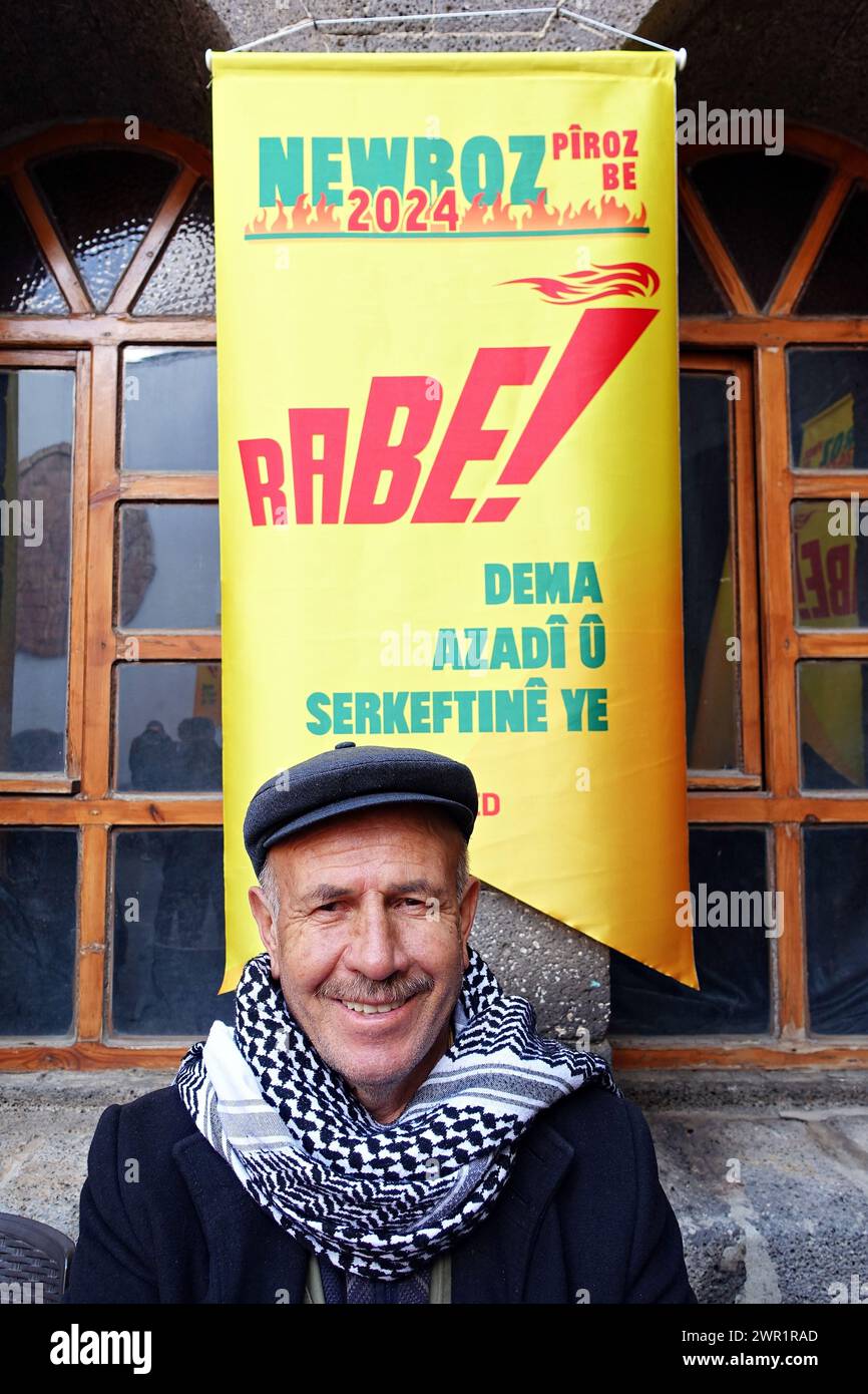 A Kurdish man in traditional clothes seen in front of the Newroz 2024 ...