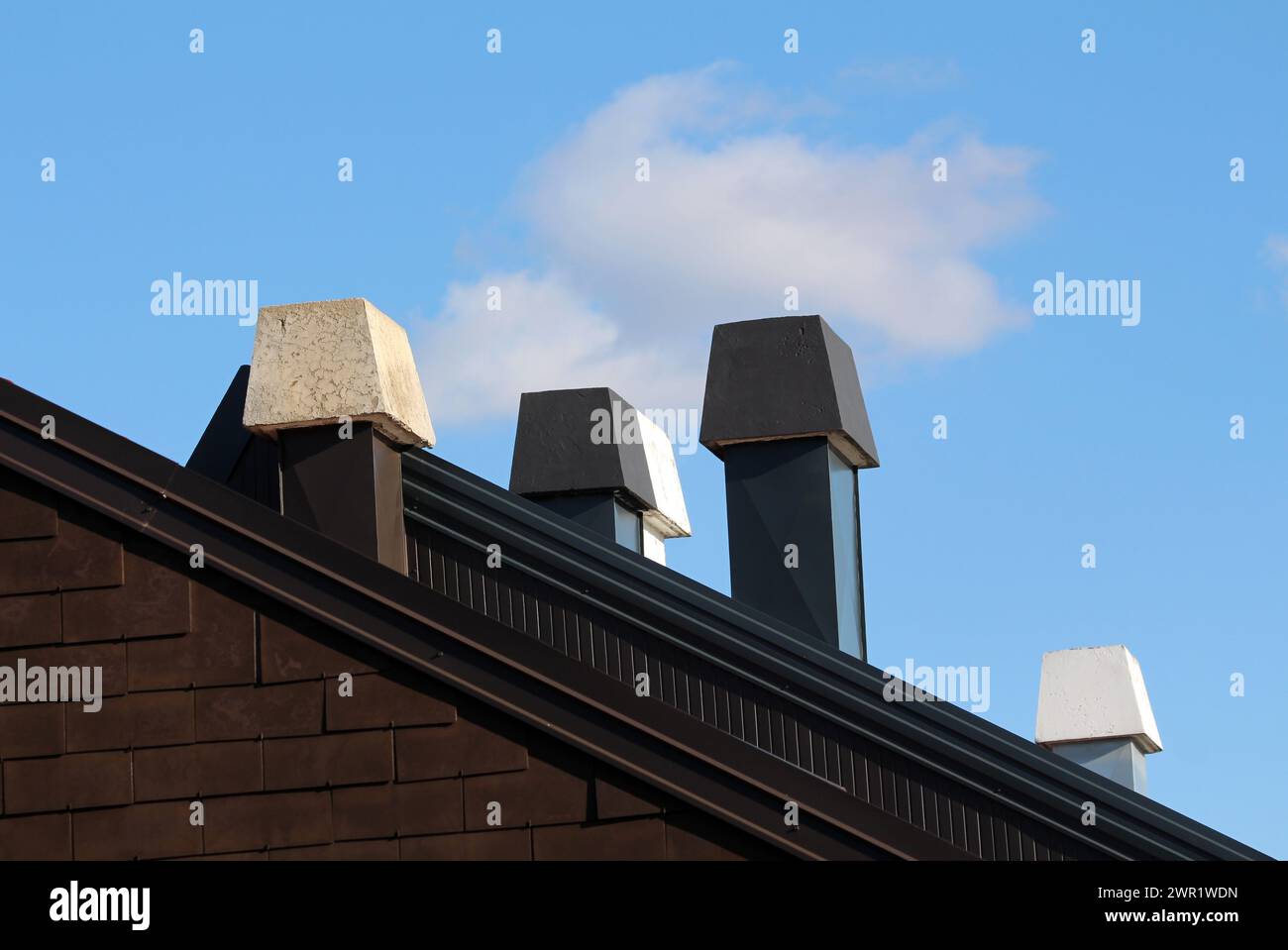 Four single and double connected dark brown to white chimneys with ...