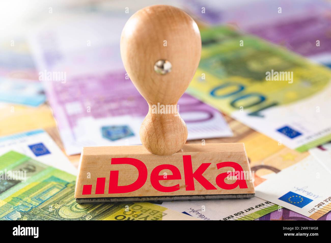10 March 2024: Stamp and money or banknotes on the table, the Deka logo ...