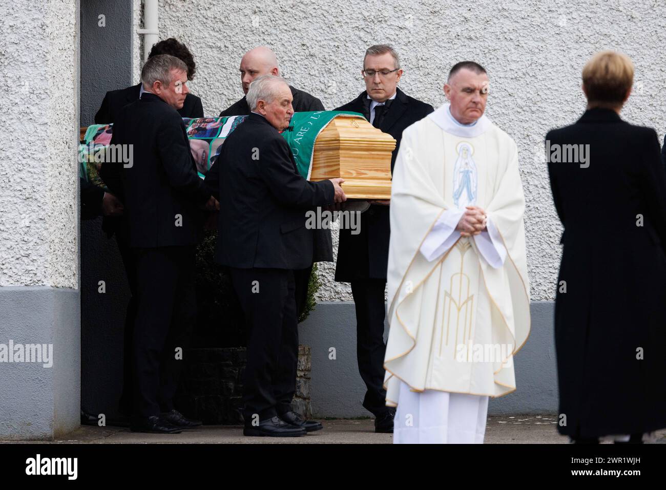 The coffin of 12-year-old Saoirse Ruane is carried out of Saints Peter ...