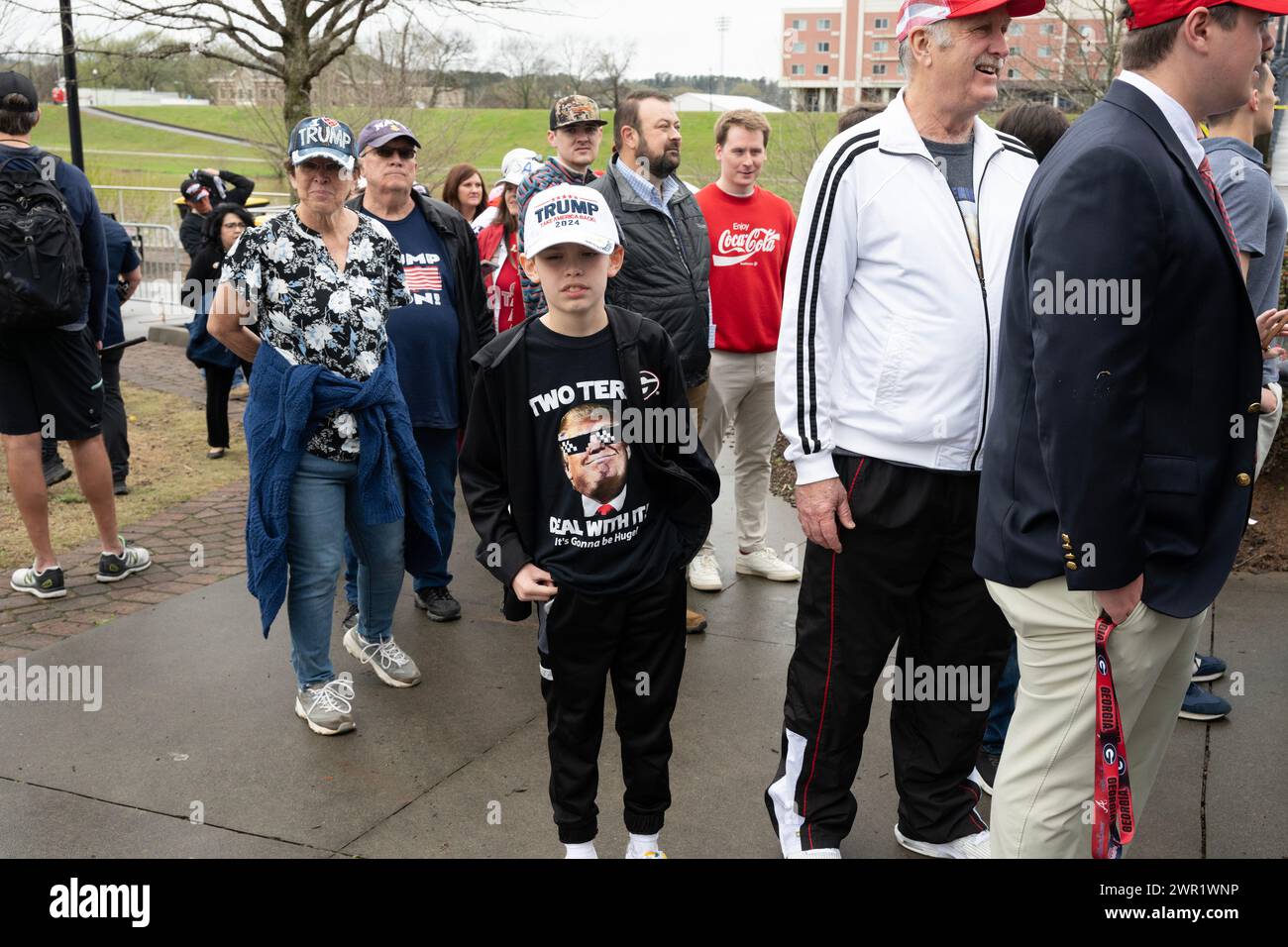 Rome, Georgia, USA. 9th Mar, 2024. A young Trump supporter waits with ...