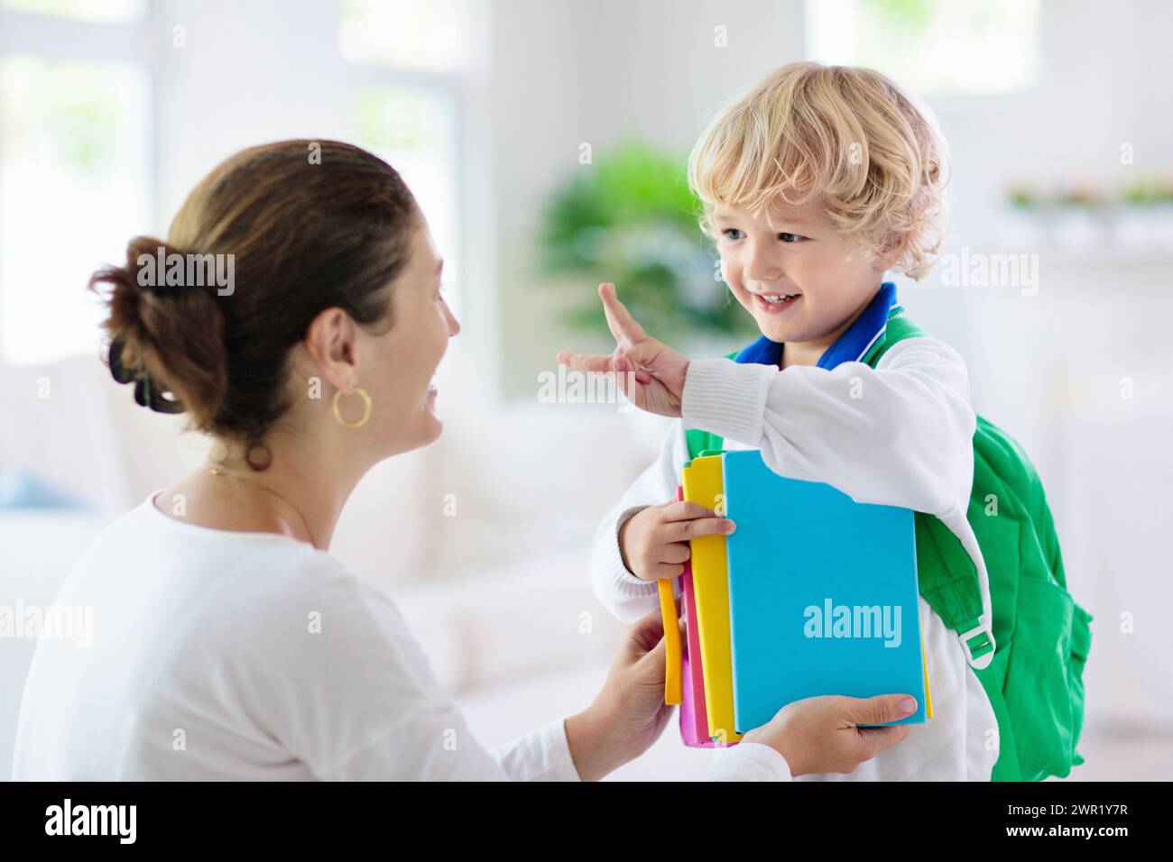 Child going back to school. Mother and kid getting ready for first ...