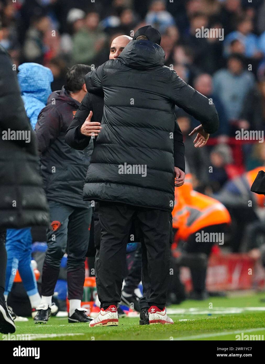 Liverpool manager Jurgen Klopp hugs Manchester City manager Pep ...