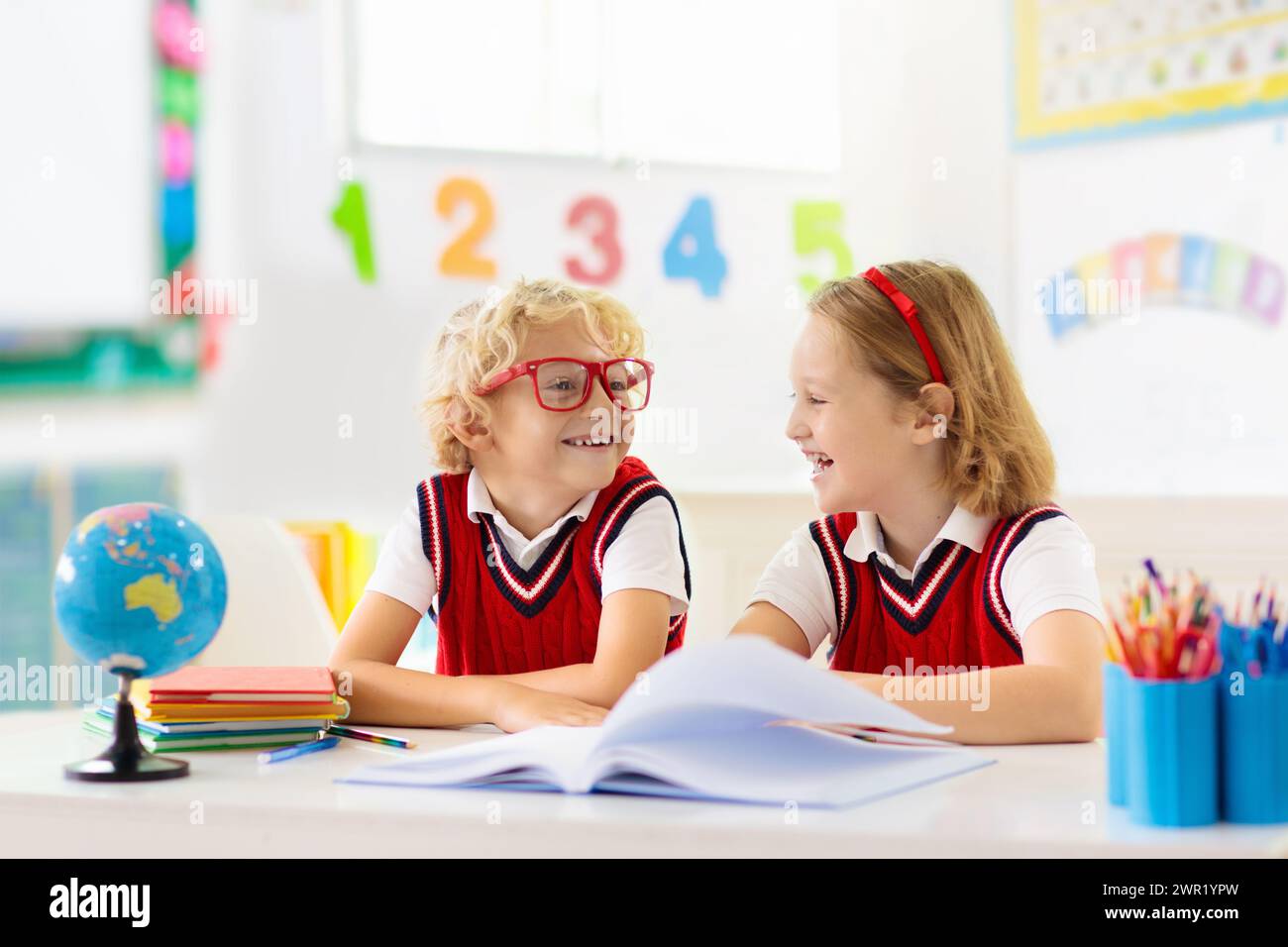 Kids go back to school. Children study and learn for preschool. Boy and ...