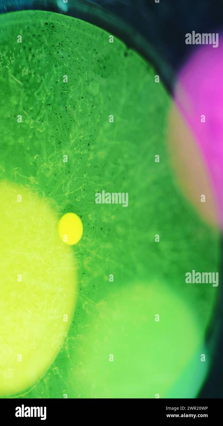 Paint water drop dye splash green pink oil bubbles Stock Photo - Alamy