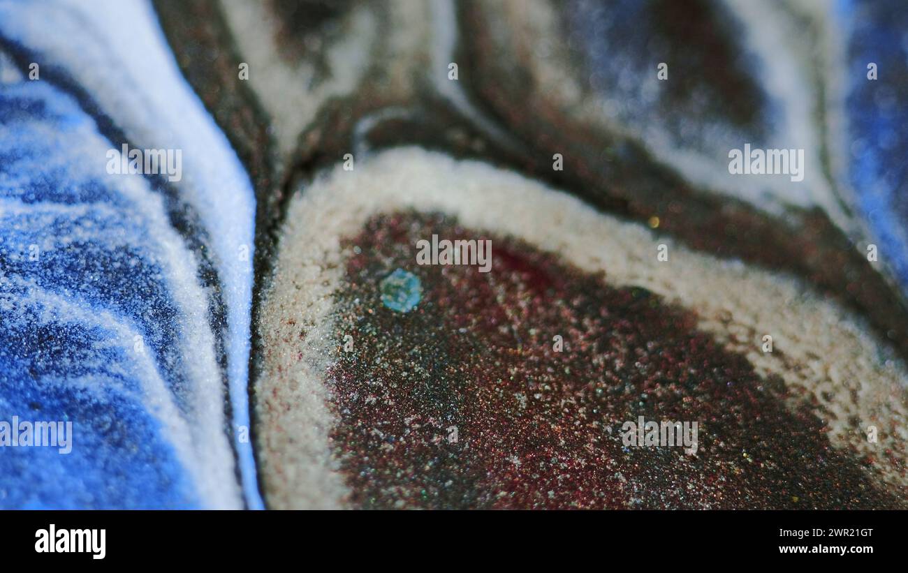 Paint spill glitter ink drip blue bronze fluid Stock Photo - Alamy