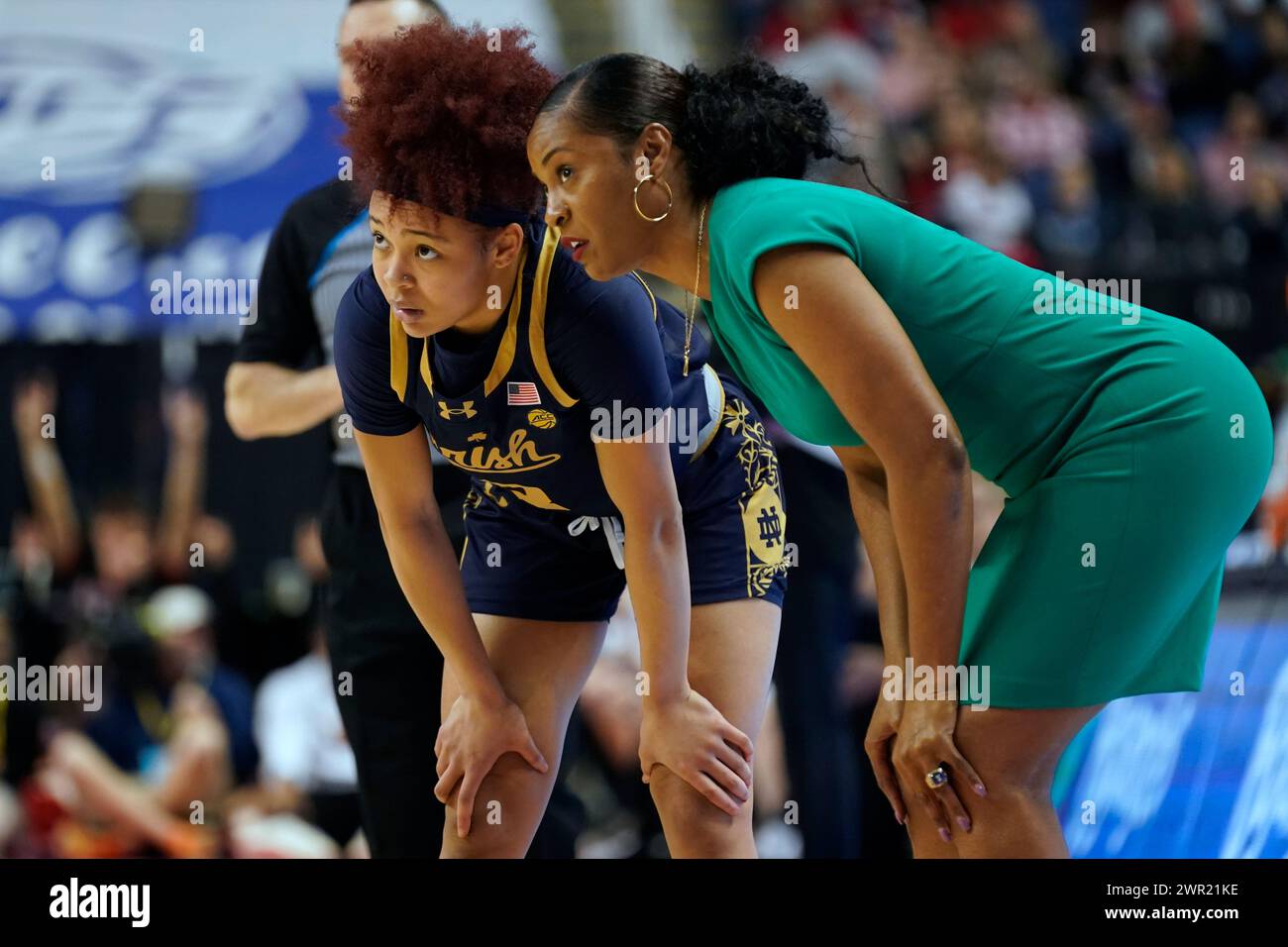 Notre Dame head coach Niele Ivey, right, talks with Hannah Hidalgo, left, during the first half ...