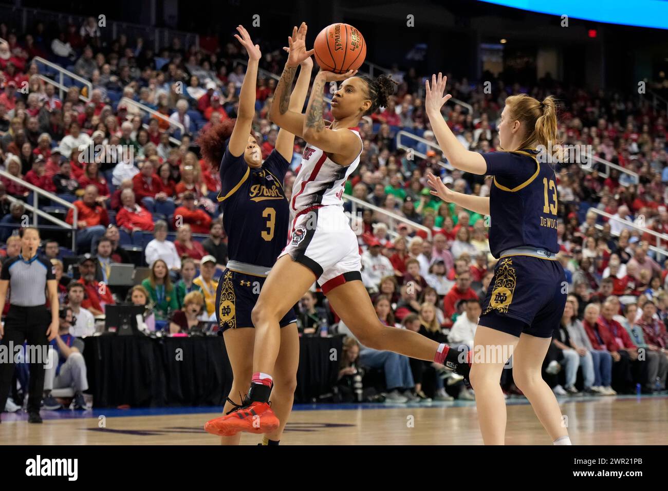 NC State's Aziaha James, center, shoots between Notre Dame's Hannah ...