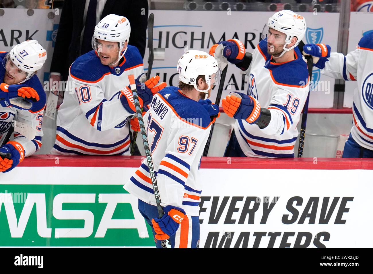 Edmonton Oilers' Connor McDavid (97) returns to his bench after scoring ...