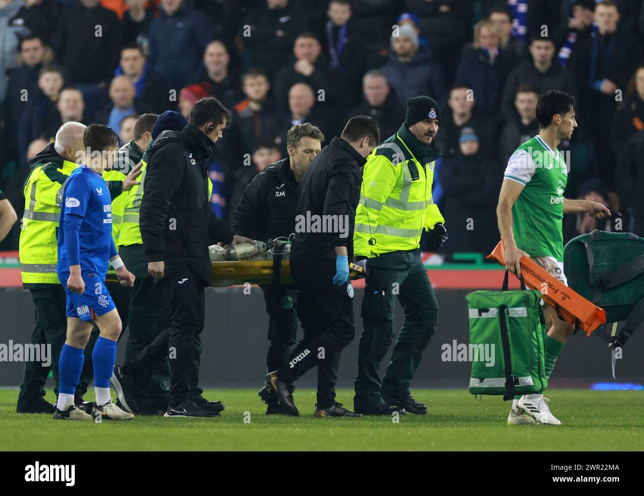 Hibernian's Martin Boyle removed from the pitch on a stretcher after ...