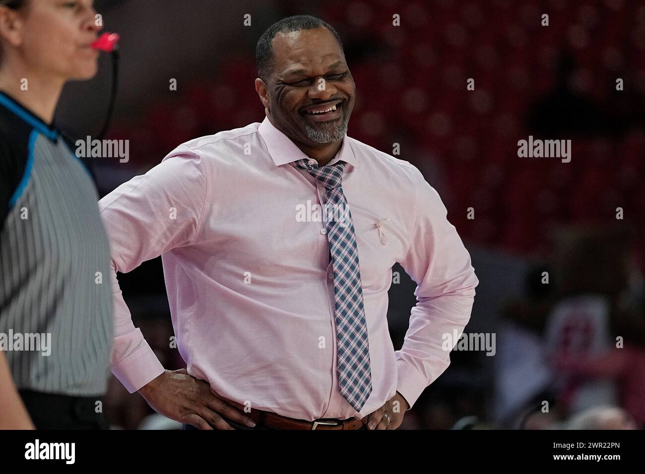 Houston head coach Ronald Hughey laughs after a call during the first ...