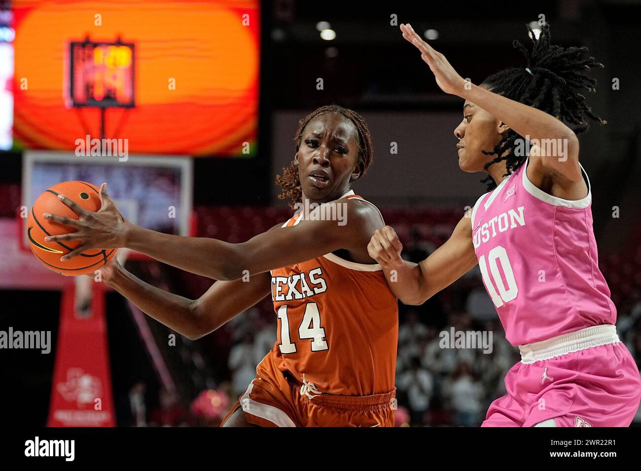 Texas forward Amina Muhammad (14) is defended by Houston guard Britney ...
