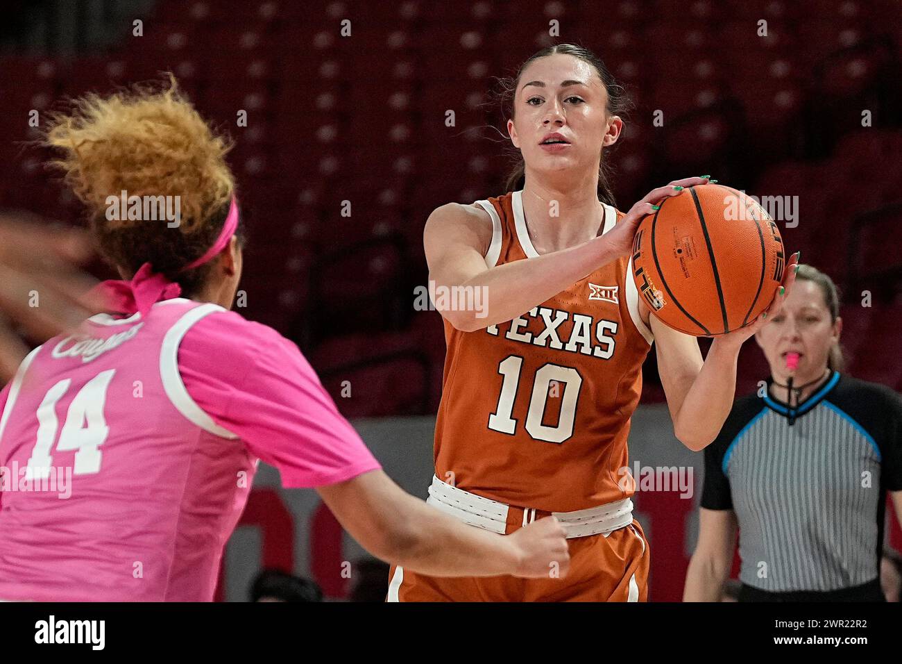 Texas guard Shay Holle looks to pass during the first half of an NCAA ...