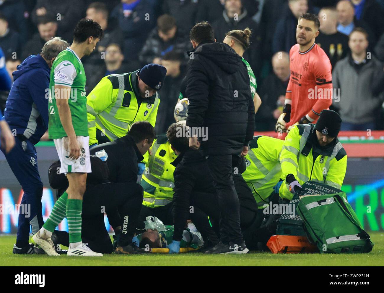 Hibernian's Martin Boyle receives treatment for an injury after a ...