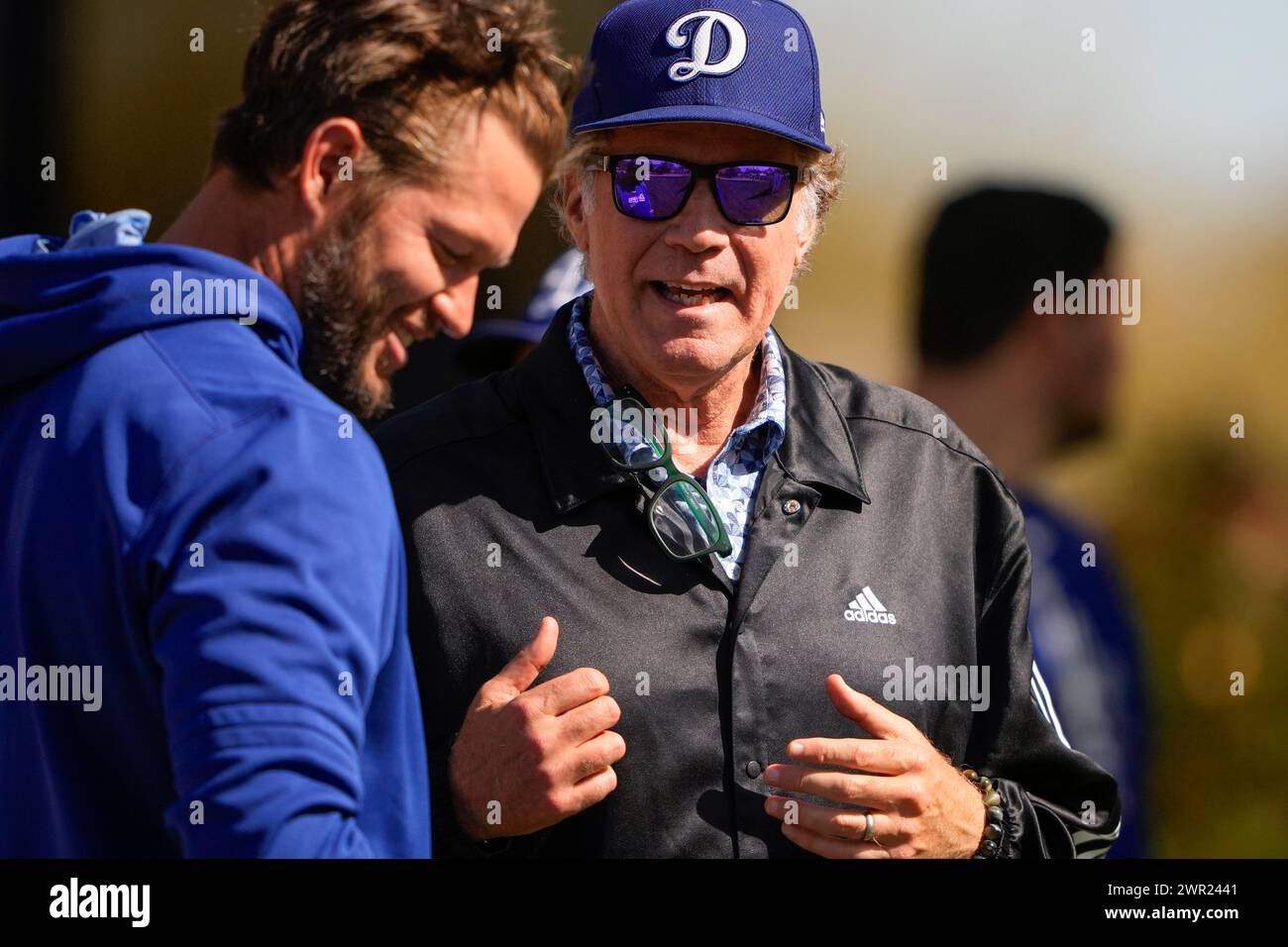 Comedian and actor Will Ferrell, right, talks with Los Angeles Dodgers ...