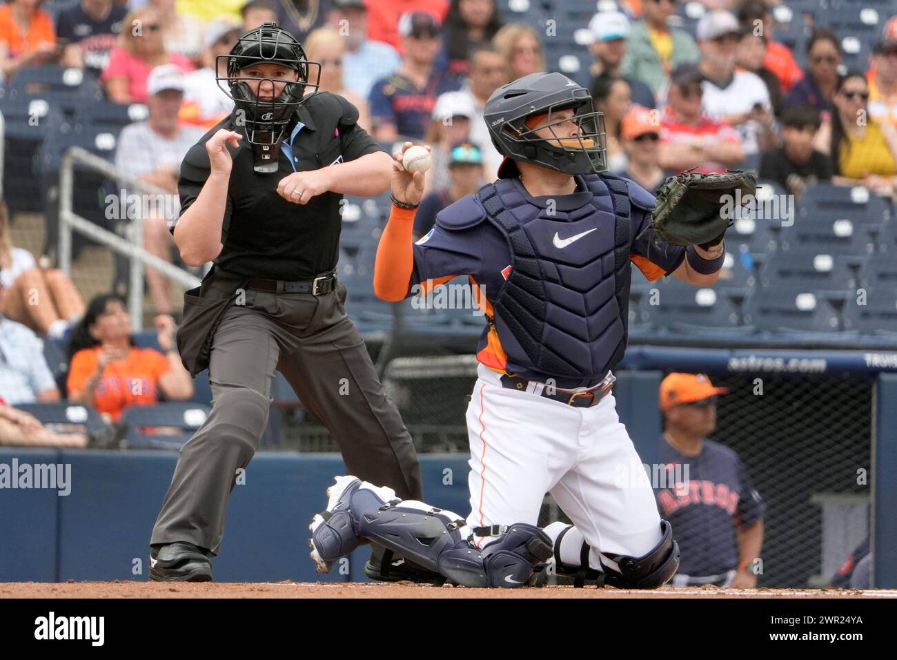 Home plate umpire Jen Pawol, left, calls a strike as Houston Astros ...