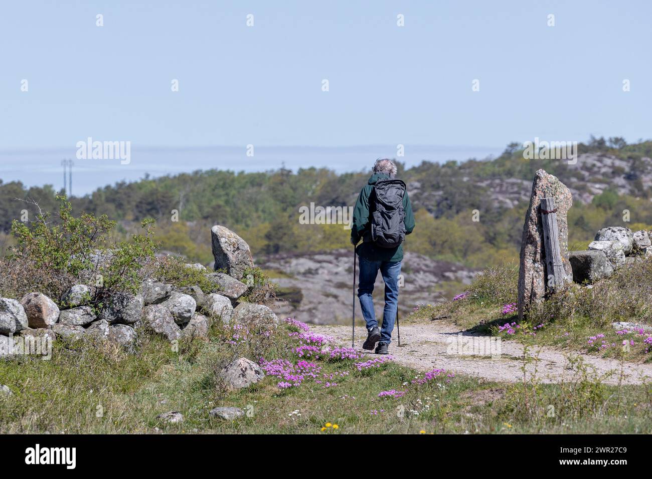 Man walking through rocks hi-res stock photography and images - Alamy