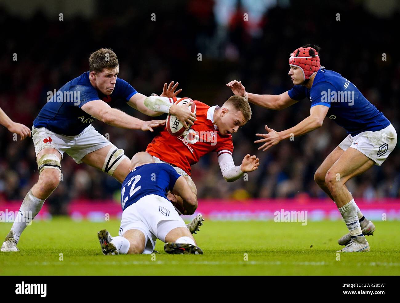 Wales' Cameron Winnett is tackled by France's Maxime Lucu during the ...