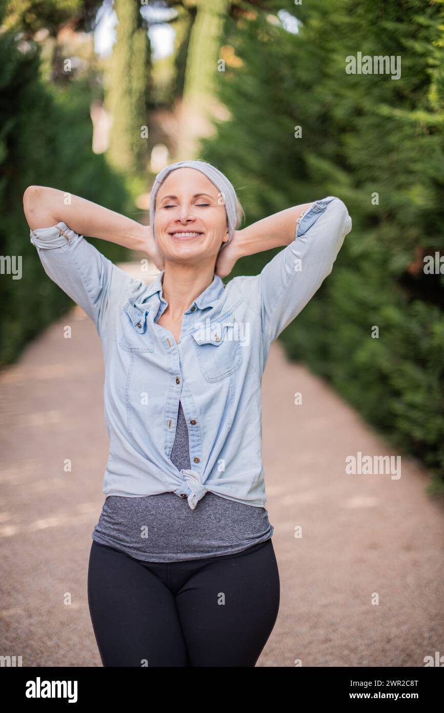 Woman smiling and laughing, enjoying the Jardines de Santa Clotilde ...