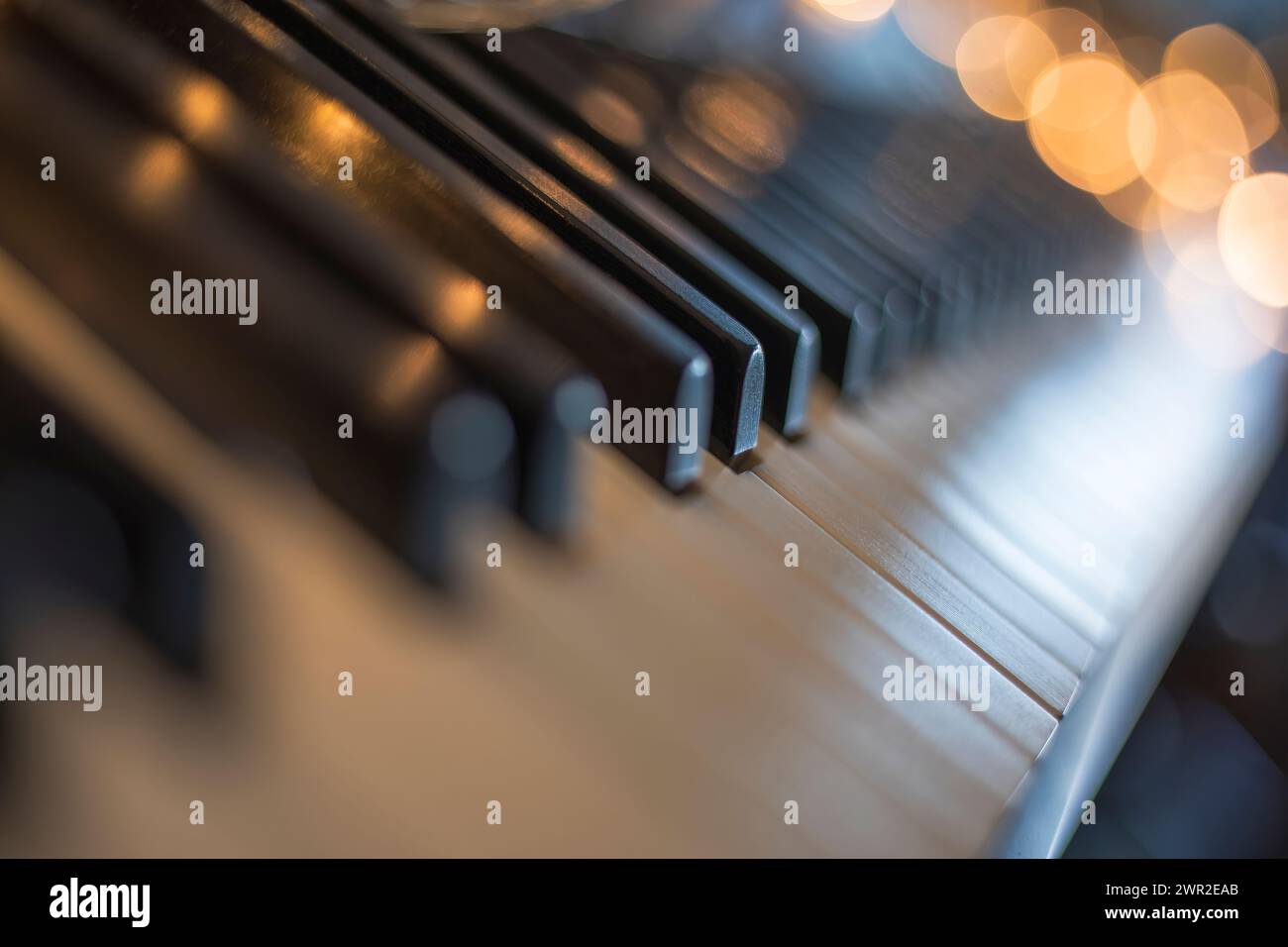 piano keys bokeh lights depth of field Stock Photo - Alamy