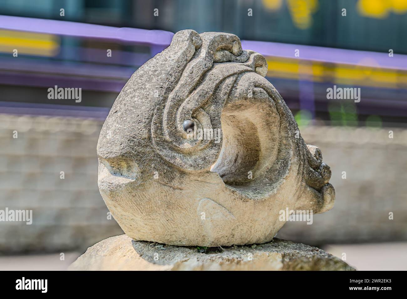 Fish sculpture, in the park, funny fish in antique decorative style ...