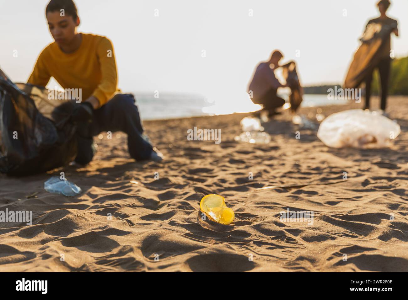 Earth day. Volunteers activists collects garbage cleaning of beach ...