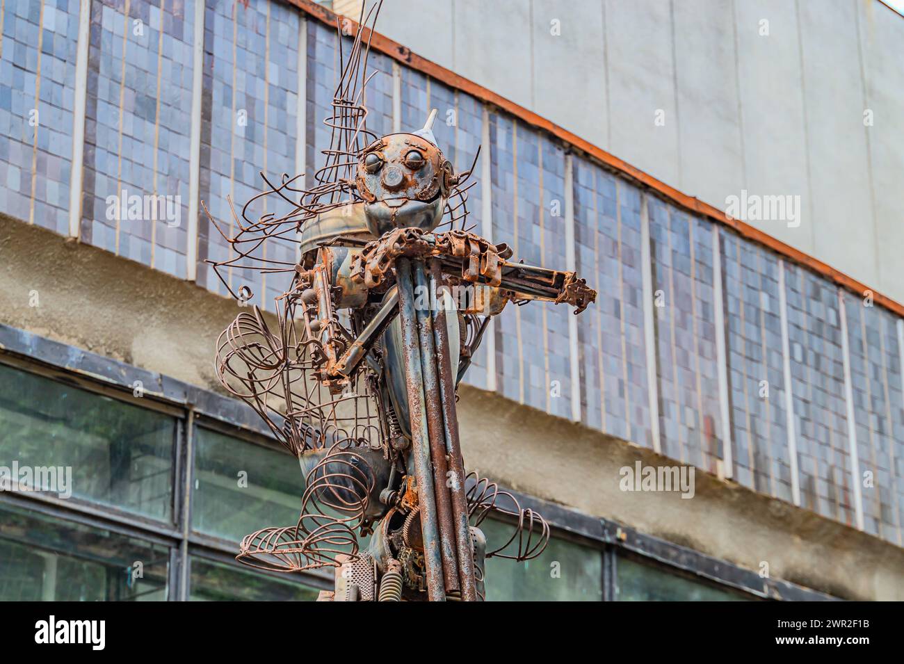 robot sculpture in the park, a robot resembling an iron lumberjack ...