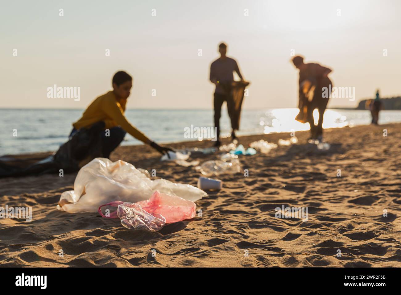 Earth day. Volunteers activists collects garbage cleaning of beach ...