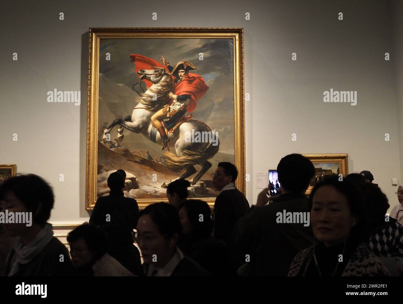 Visitors view paintings of Jacques-Louis David Napoleon at the Great St ...