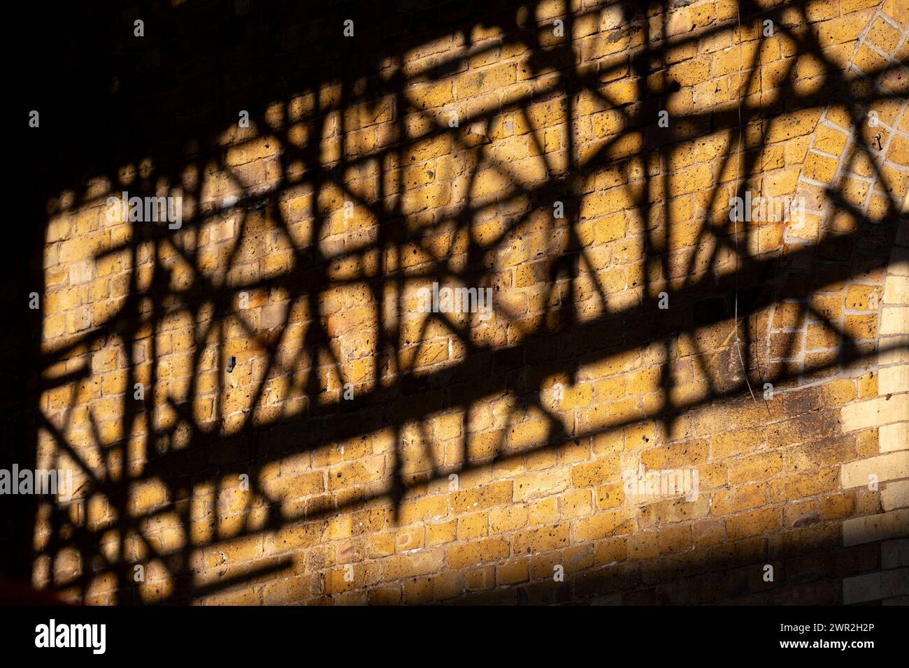 Shadows shadow brick wall hi-res stock photography and images - Alamy