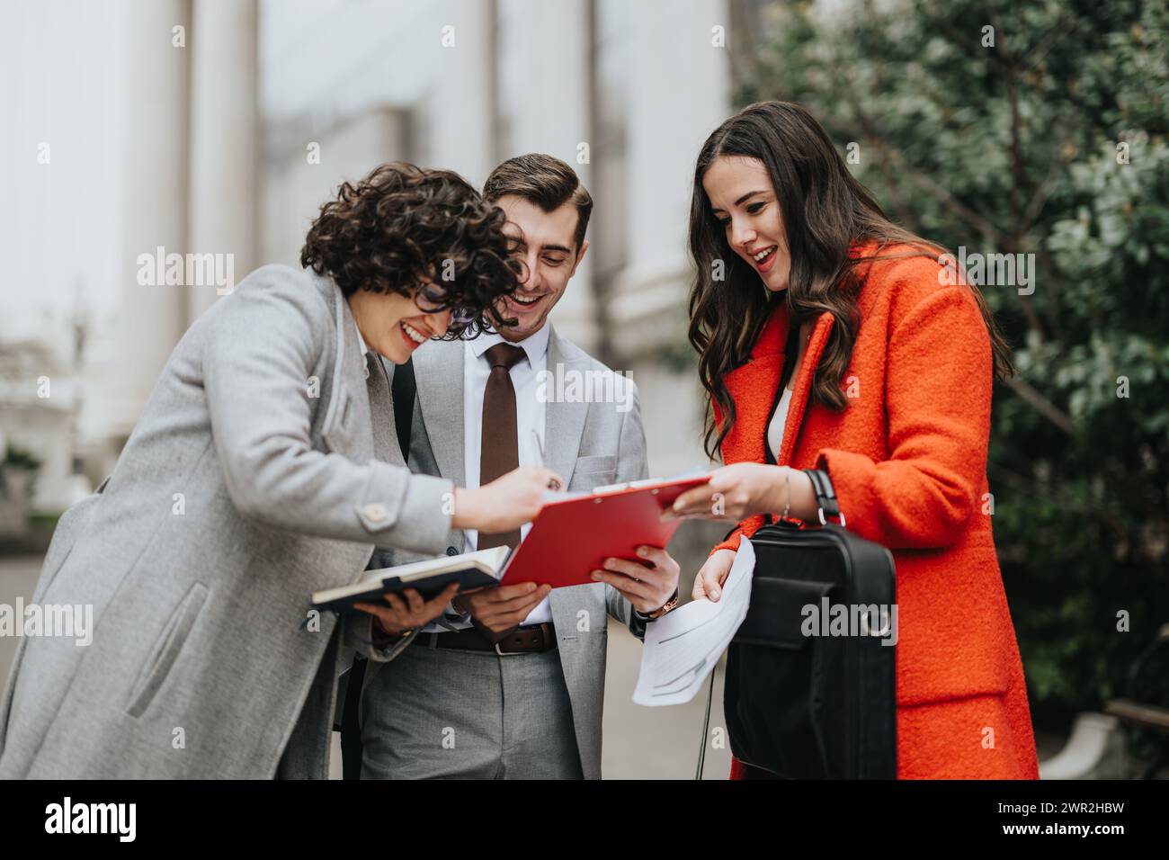 Business associates engaged in hi-res stock photography and images - Alamy