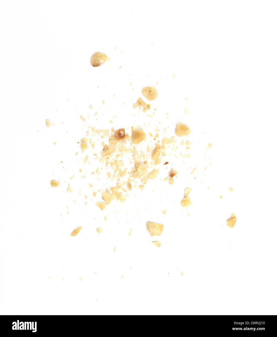 Ground, milled, crushed or granulated hazelnut pile isolated on white ...