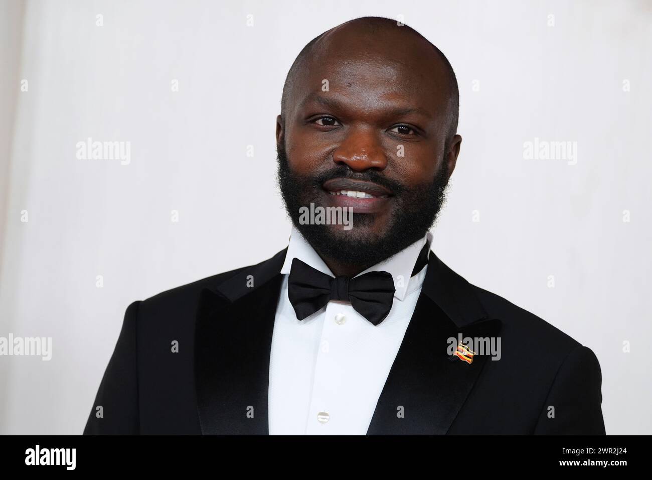 Moses Bwayo arrives at the Oscars on Sunday, March 10, 2024, at the Dolby Theatre in Los Angeles ...