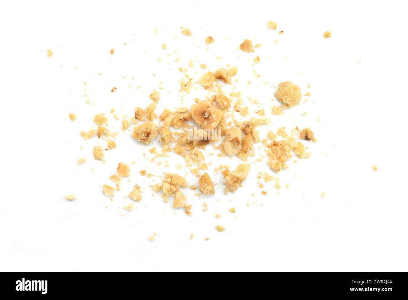Ground, milled, crushed or granulated hazelnut pile isolated on white ...
