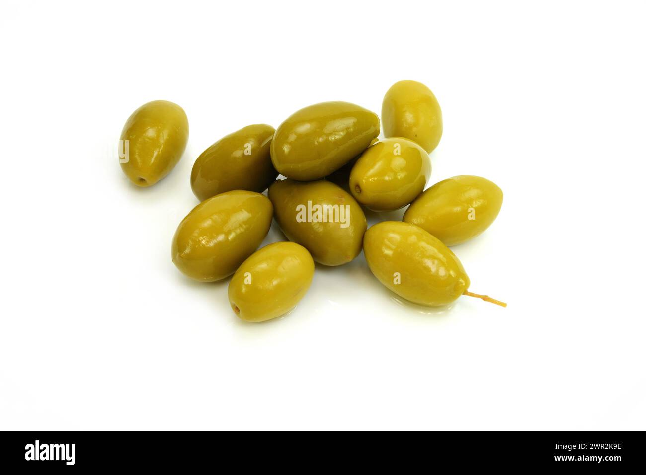 Green olives isolated on a white background. Top view Stock Photo - Alamy