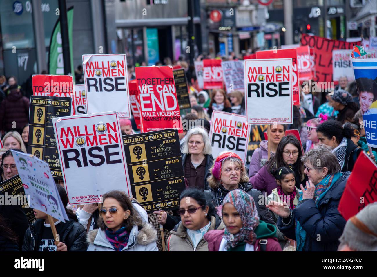 A crowd of protestors hold placards during the march at the Million ...