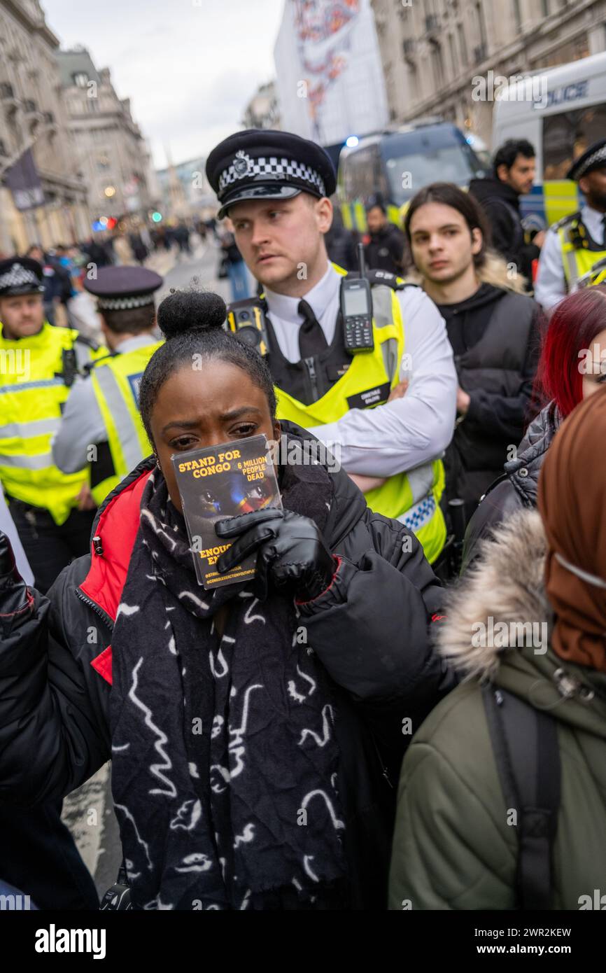Metropolitan Police Officers watch over a British Congolese ...