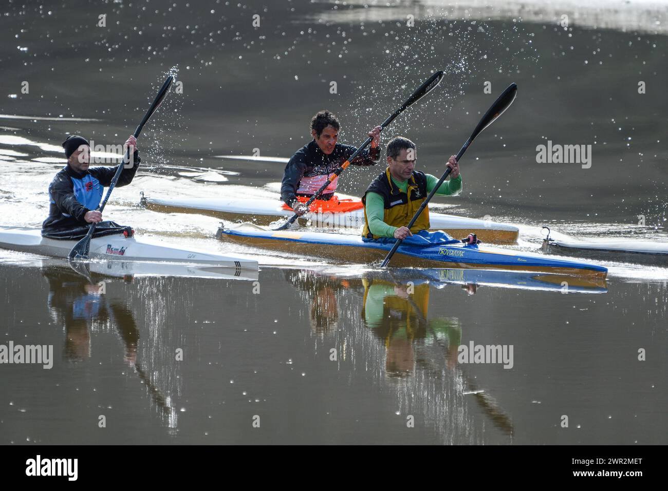 Three people canoeing in the Plentzia estuary Stock Photo - Alamy
