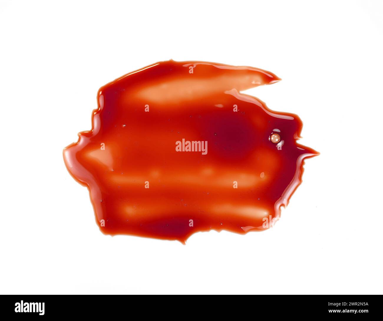 Pomegranate sauce dressing isolated on white. Pomegranate syrup puddle ...