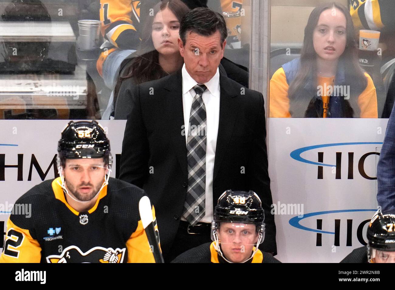 Pittsburgh Penguins head coach Mike Sullivan stands behind his bench ...