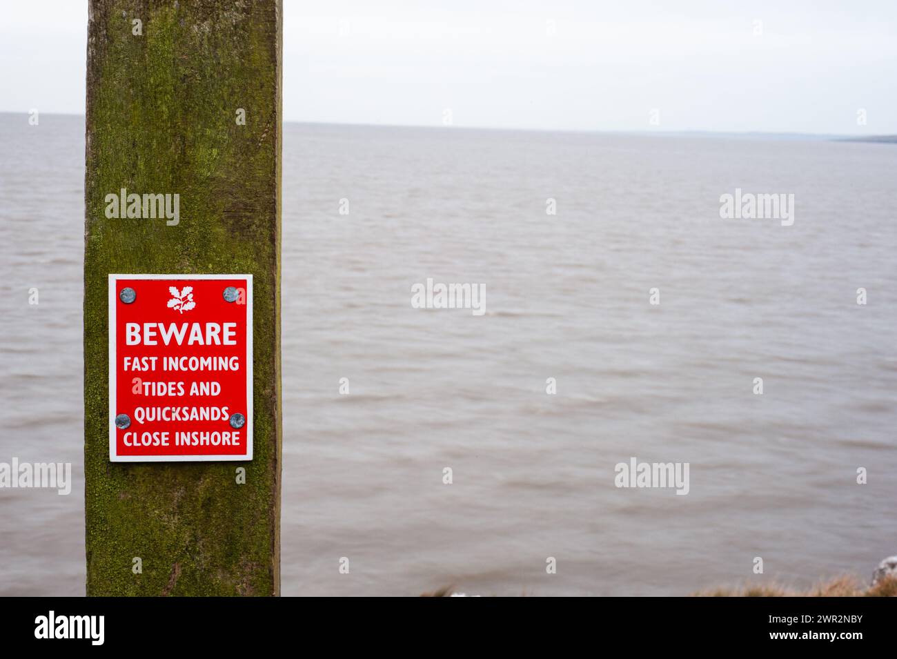A warning sign of Fast incoming Tide and quicksands, Cumbria, England ...