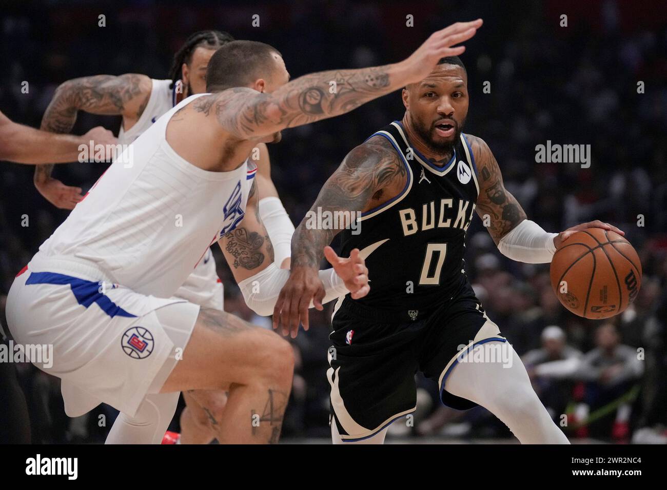 Milwaukee Bucks guard Damian Lillard (0) drives against Los Angeles ...